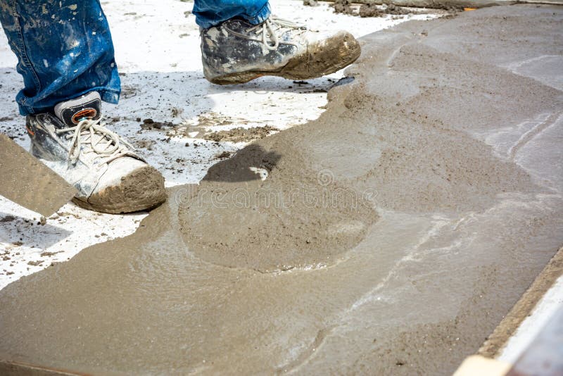 Worker Spreading Building Screed on a Floor of a House during Energy ...