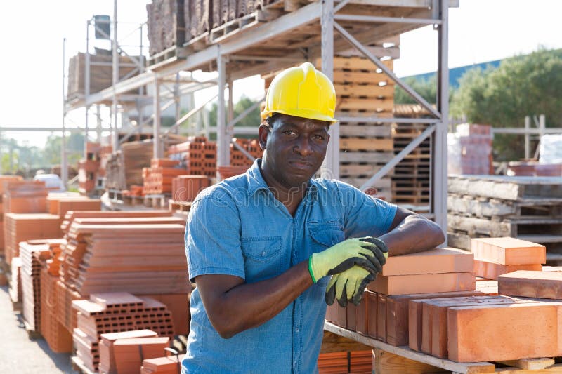 Worker Stacking Bricks in Warehouse of Building Materials Clpseup Stock ...