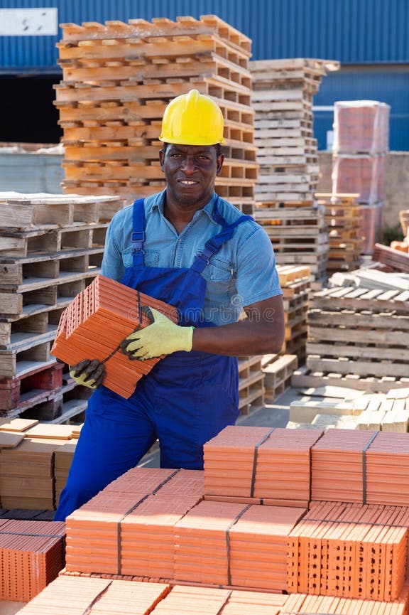Worker Stacking Bricks in Warehouse of Building Materials Clpseup Stock ...