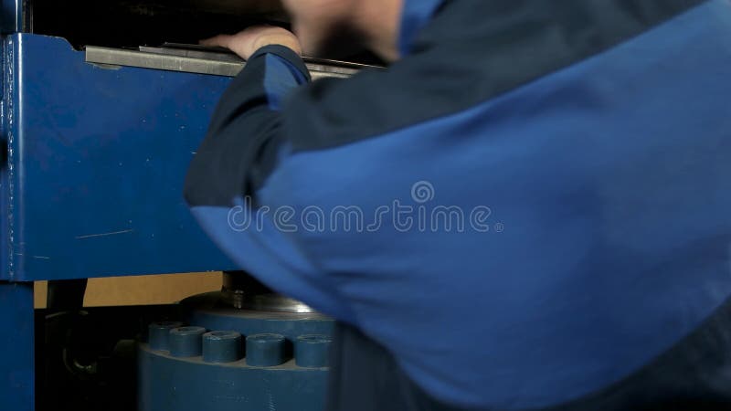 Worker and stamping press. stock footage. Video of hand - 95414850