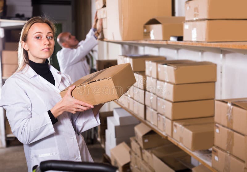 Worker Standing with Boxes in Production Workshop Stock Image - Image ...