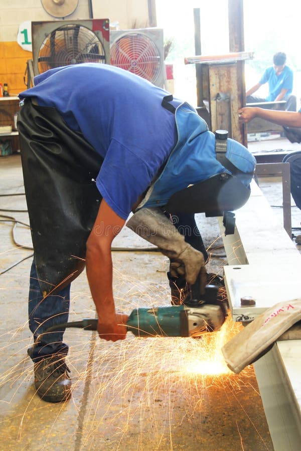 Worker standing grinding stock photo. Image of back, build - 34832688