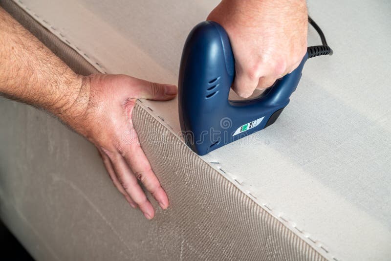 Worker Stapling Sofa Lining with Electric Staple Gun Stock Image ...