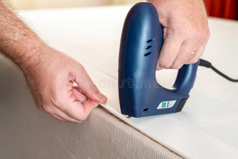 Worker Stapling Sofa Lining with Electric Staple Gun Stock Photo ...