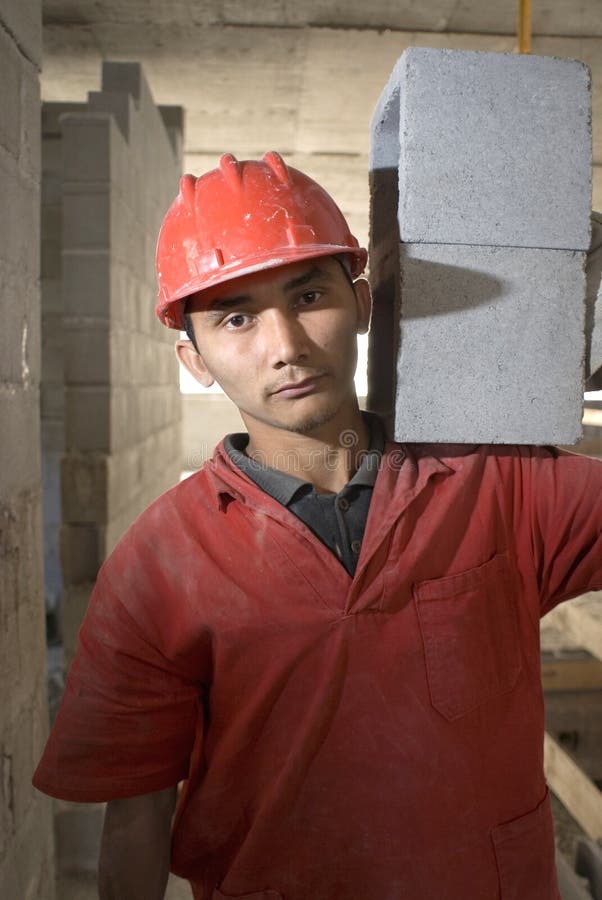 Worker Stares At Camera. Vertically Framed Photo. Stock Photo - Image ...