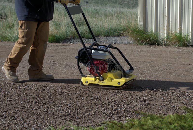 Small compactor at work. stock photo. Image of newly - 280349360
