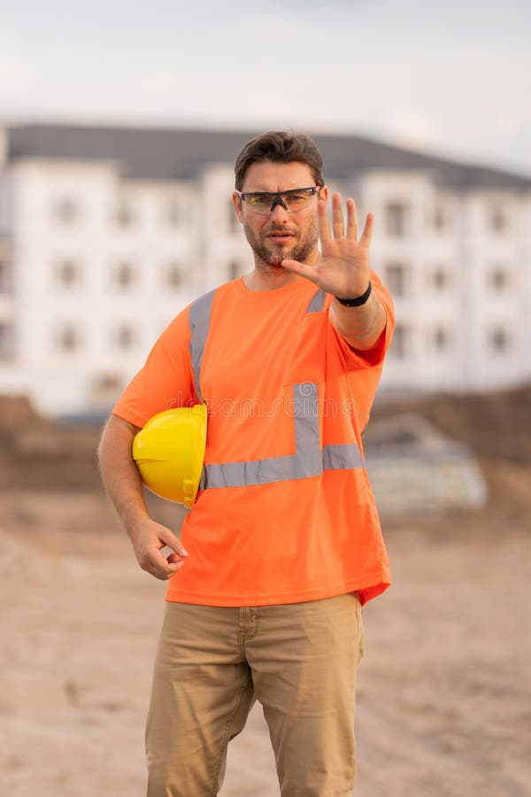 Worker with Stop Hand Gesture. Construction Worker with Hardhat Helmet ...