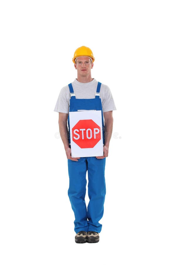 Worker with a stop sign stock photo. Image of level, brick - 26704368