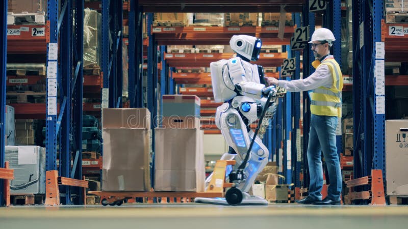 Worker Stops Warehouse Robot To Scan Barcodes on Boxes Stock Video ...