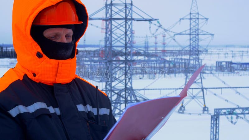 Worker at Substation Checking Documents. Winter Conditions Highlight ...
