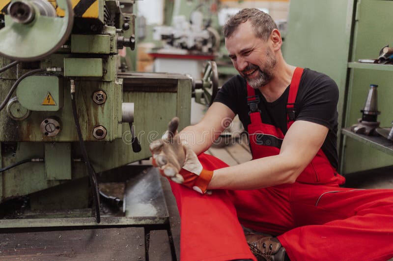 Worker Suffering from Pain after Accident in Factory. First Aid Support ...