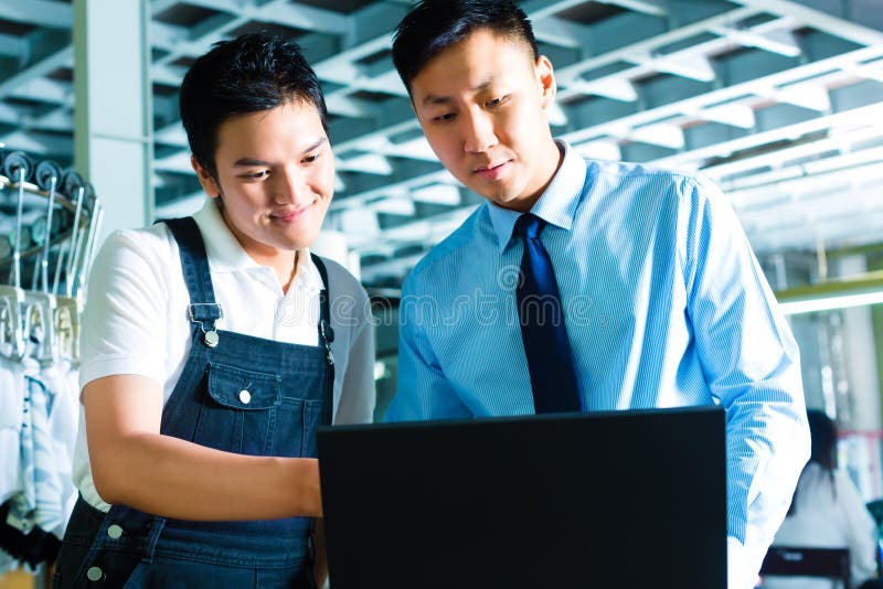 Worker and Supervisor with Laptop in a Factory Stock Photo - Image of ...