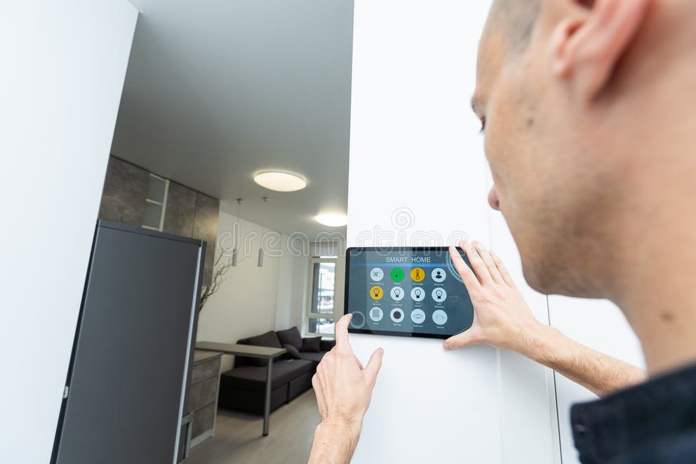 Worker with Tablet Computer Checking Alarm System Indoors Stock Image ...