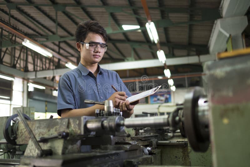 Worker Take Note for Check Machine. Stock Image - Image of note ...