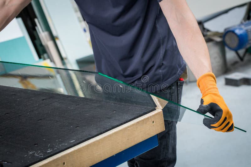 The Worker Takes the Glass Off the Table in the Glass Workshop Stock ...