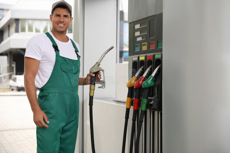 Worker Taking Fuel Pump Nozzle at Modern Gas Station Stock Image ...