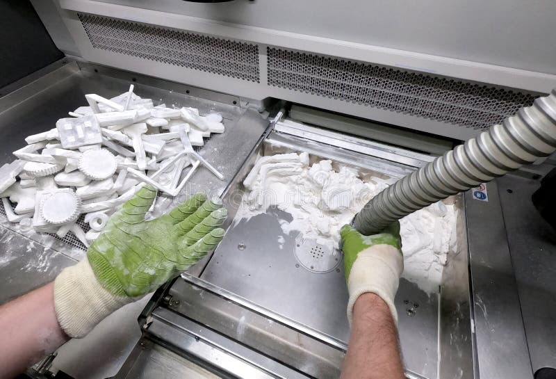 Worker Taking Out Models of White Polyamide Powder and Cleaning Them ...