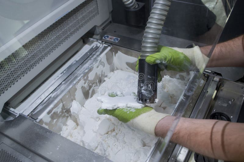 Worker Taking Out Models of White Polyamide Powder and Cleaning Them ...