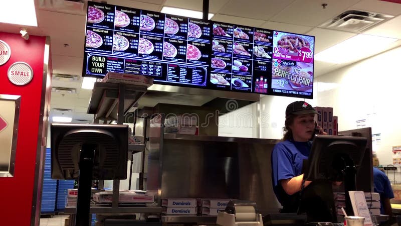 Worker Taking Phone Call for Customer Ordering Domino Pizza Stock ...