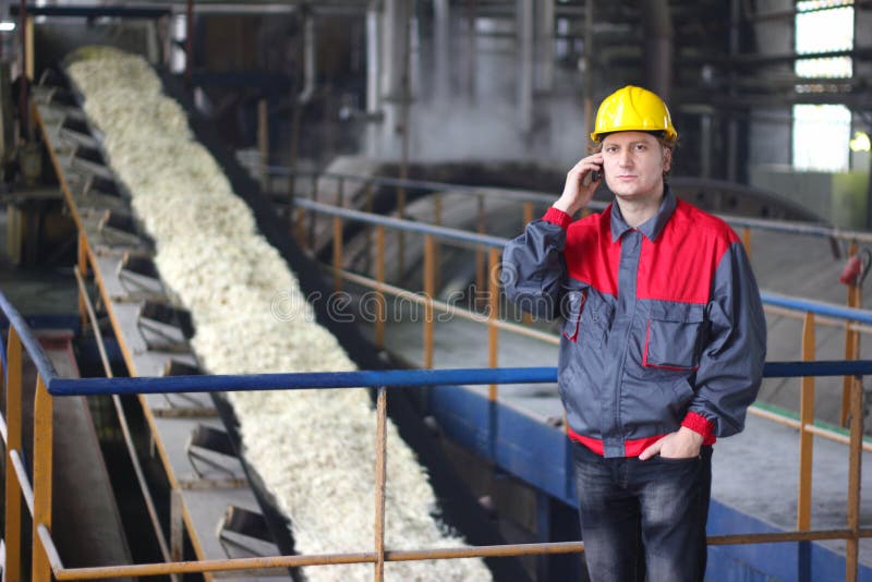 Worker Talking on Cell Phone Stock Photo - Image of belt, heat: 27355674