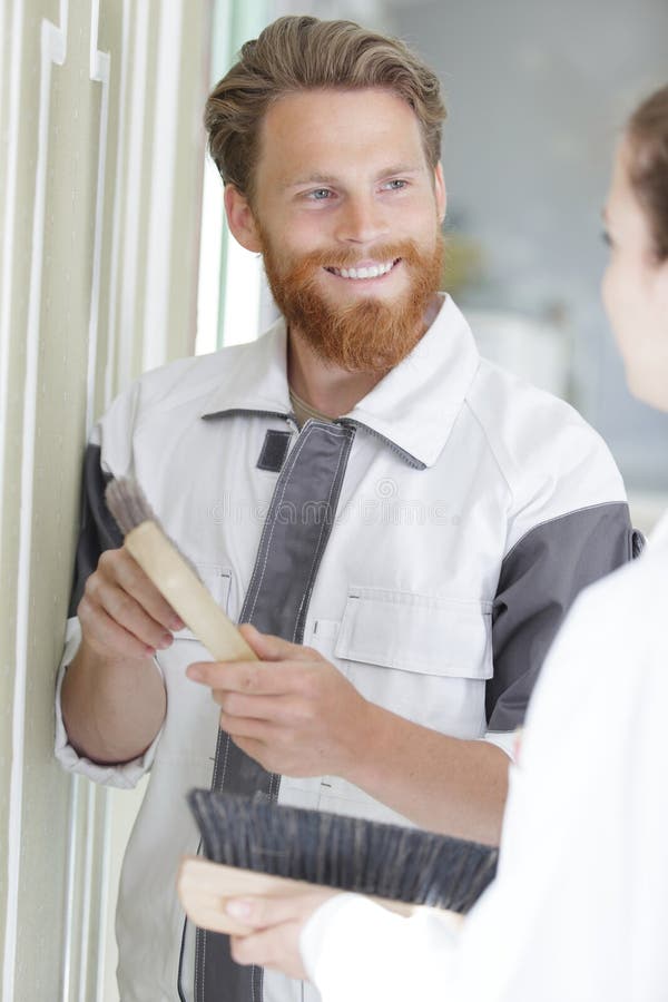 Worker talking and smiling stock photo. Image of person - 298849684
