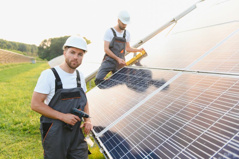 Worker Team with Solar Panel. Worker Team Has Success Install Solar ...