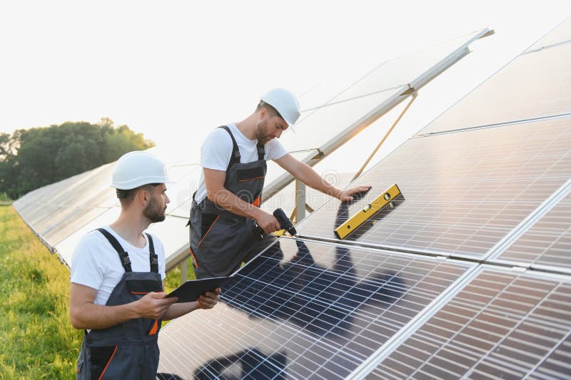 Worker Team with Solar Panel. Worker Team Has Success Install Solar ...