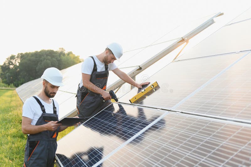 Worker Team with Solar Panel. Worker Team Has Success Install Solar ...