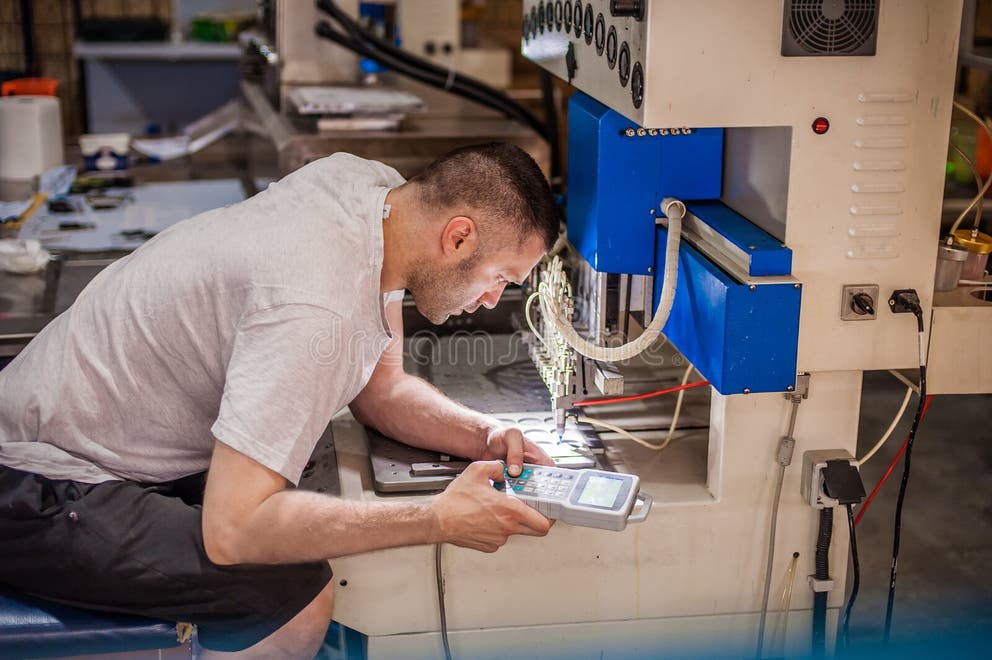 Worker Technician Engineer Programming Soft PVC Dispensing Machine in ...