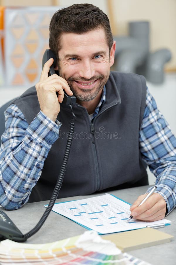 Worker on Telephone Writing on Clipboard Stock Photo - Image of shirt ...