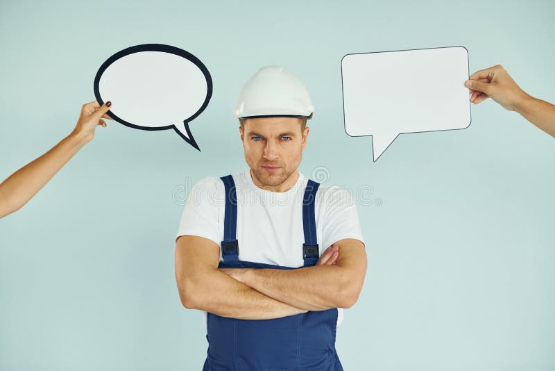 Worker is Thinking. Man Standing in the Studio with Empty Signs for the ...