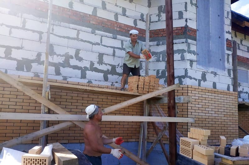 Worker Throws Bricks Stock Photos - Free & Royalty-Free Stock Photos ...
