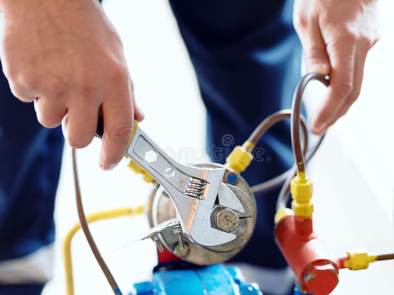 Worker Tightens Nut of Gas Equipment with Adjustable Wrench. Hands ...