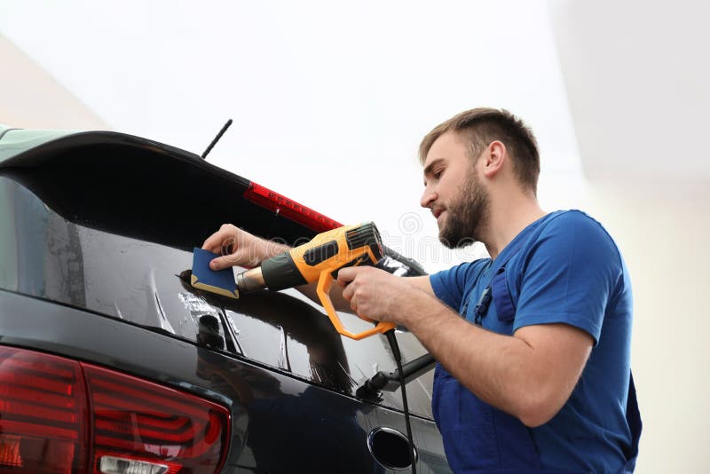 Worker Tinting Car Window with Heat Gun Stock Image - Image of person ...