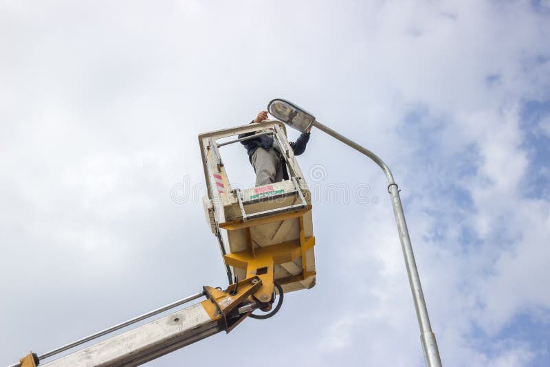 Worker on Top of a Pole Fixing the Supply 3 Stock Photo - Image of ...