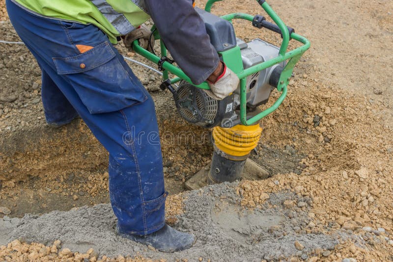 Worker Compacting Sand Bedding Mechanical Rammer Stock Photos - Free ...