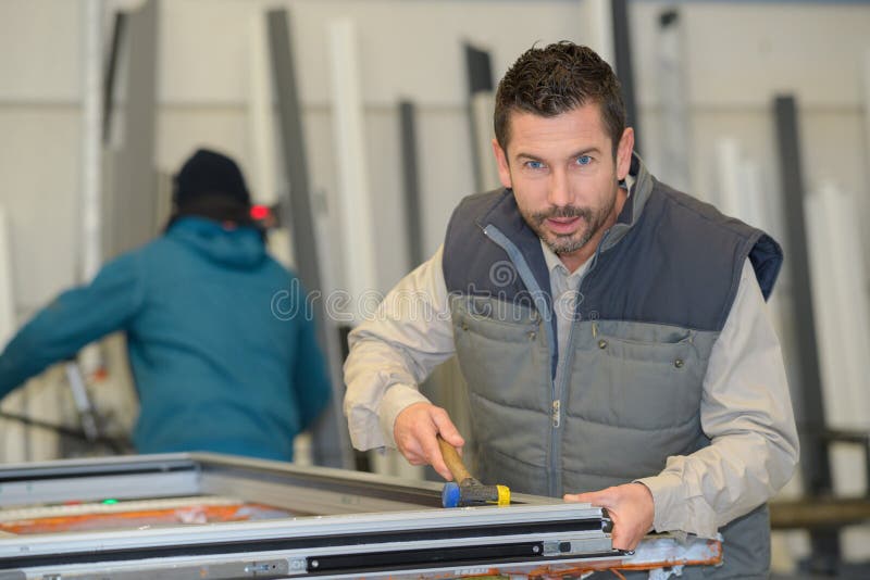Worker in Uniform Checking Quality in Production Factory Stock Photo ...