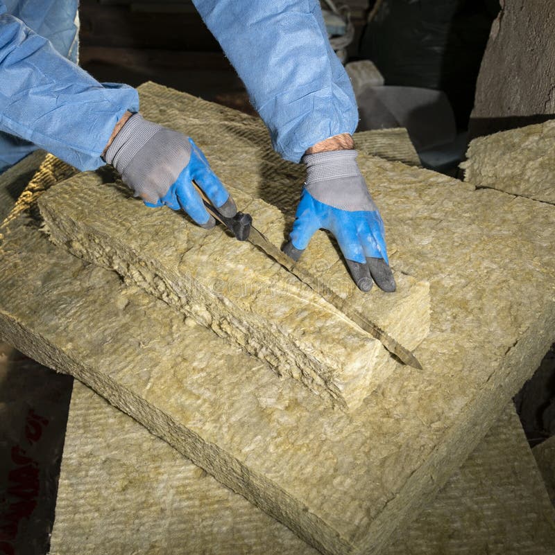 Worker in Uniform Cutting Mineral Wool Panels Stock Image - Image of ...
