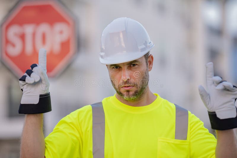 Worker in Uniform Gesturing Stop. Worker Builder in Hard Hat with Stop ...