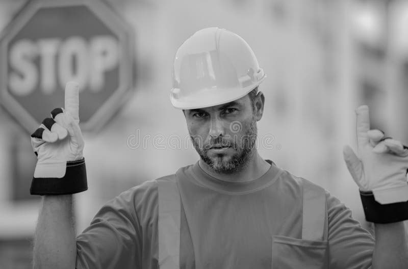 Worker in Uniform Gesturing Stop. Worker Builder in Hard Hat with Stop ...