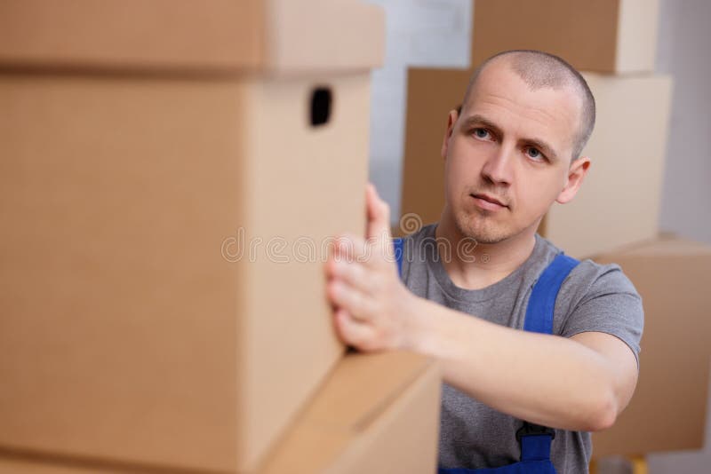 Worker in Uniform Holding Big Box in Warehouse Stock Image - Image of ...