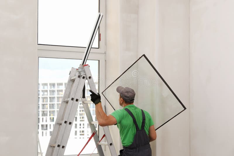 276 Worker Carrying Window Stock Photos - Free & Royalty-Free Stock ...