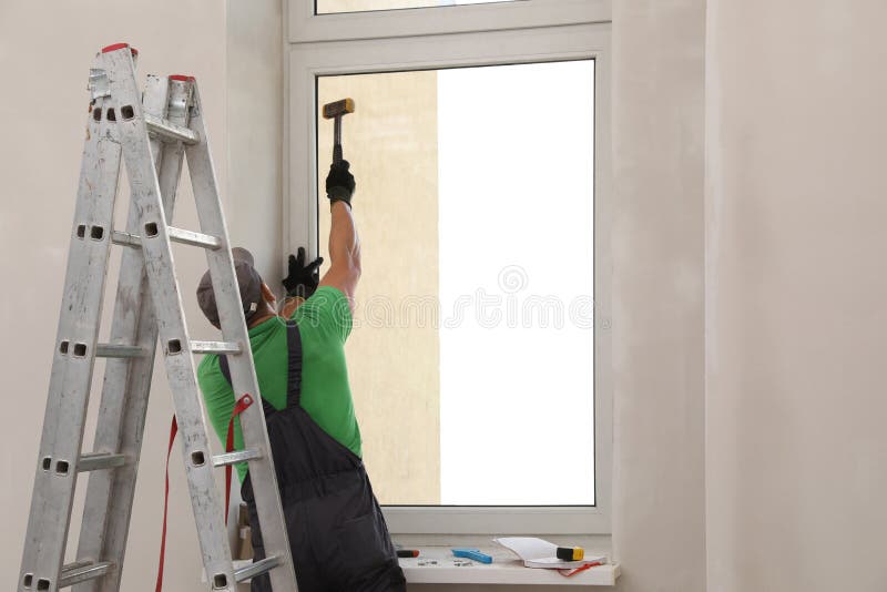 Worker in Uniform Installing Double Glazing Window Indoors, Back View ...