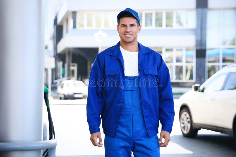 Worker in Uniform at Modern Gas Station Stock Photo - Image of drive ...