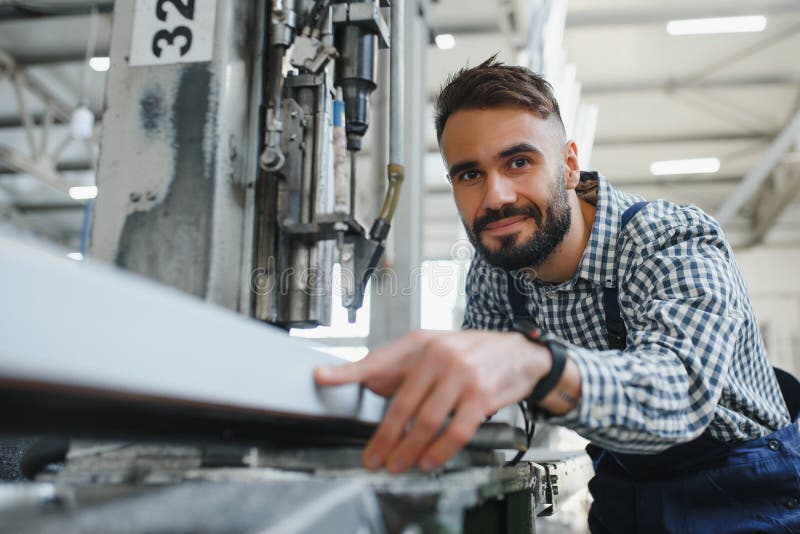 Worker in Uniform Working on Machine in PVC Shop Indoor Stock Photo ...