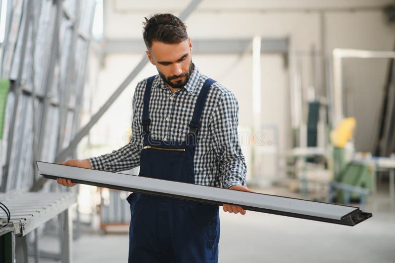 Worker in Uniform Working on Machine in PVC Shop Indoor Stock Photo ...