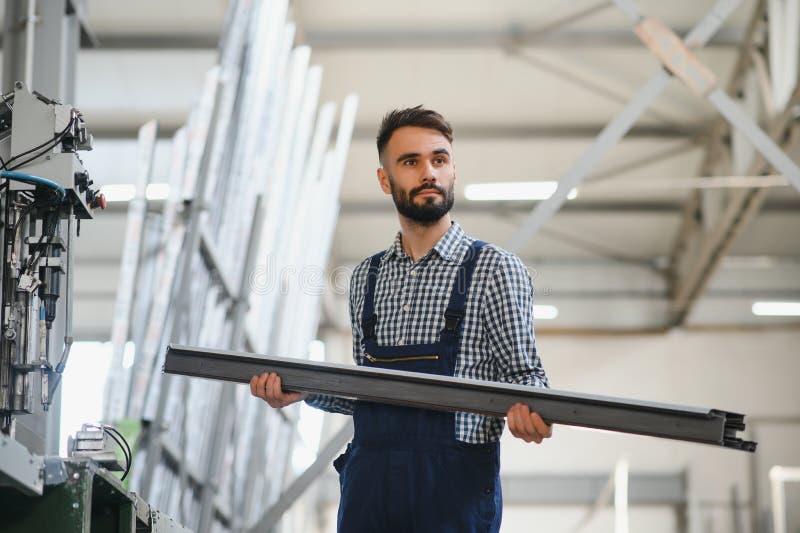 Worker in Uniform Working on Machine in PVC Shop Indoor Stock Photo ...