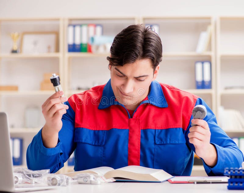 Worker in Uniform Working on Project Stock Photo - Image of bulb ...