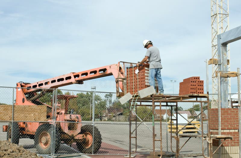 Worker Unloading Brick stock image. Image of industrial - 8059481