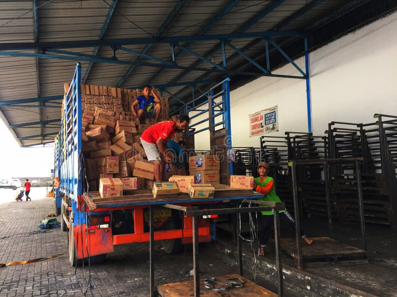 A Worker is Unloading Goods Editorial Image - Image of technician ...